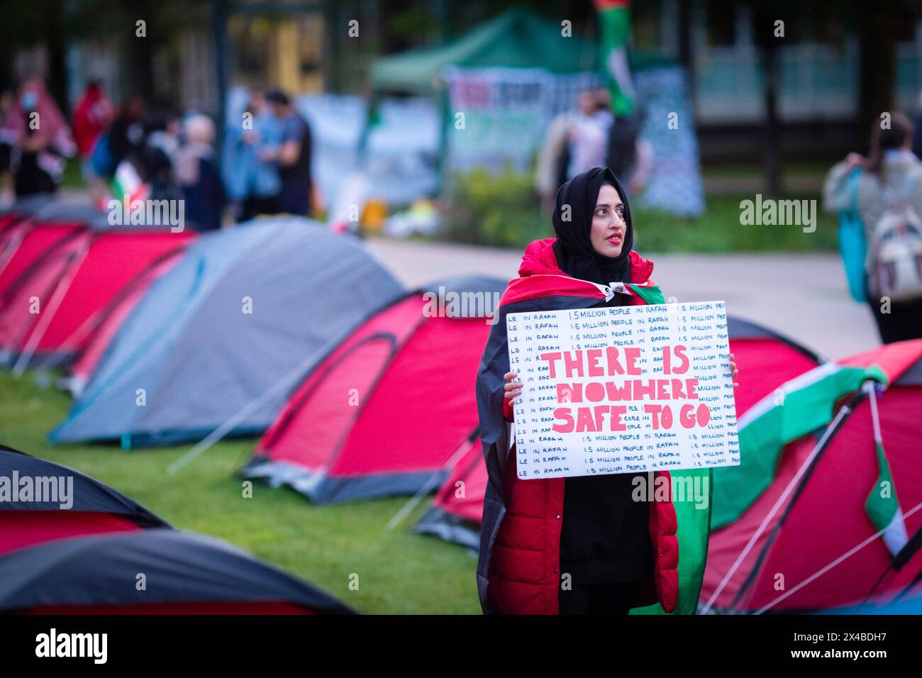 Manchester, UK. 01st May, 2024. A pro-Palestine supporter holds a ...