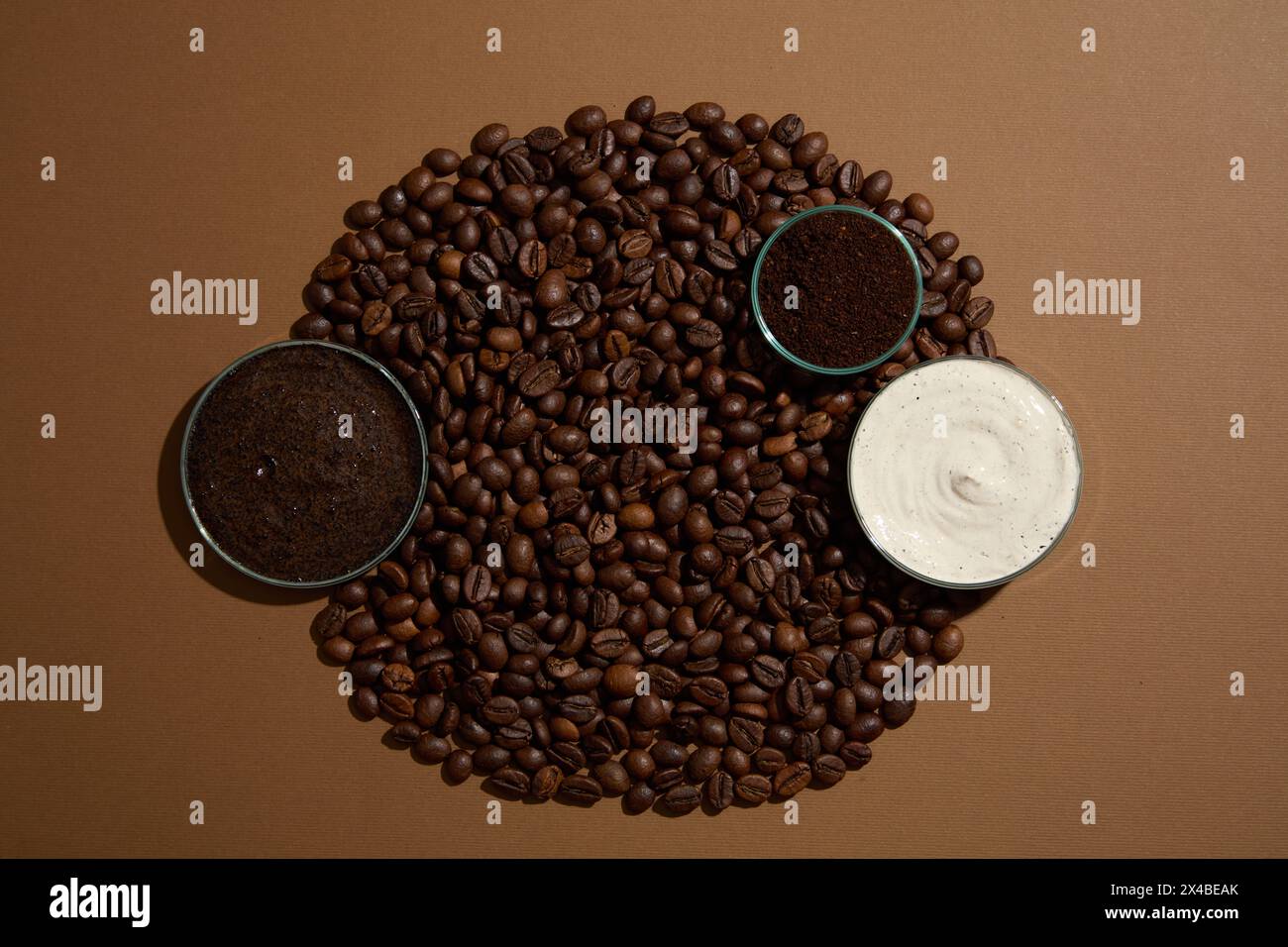 Against a brown background, coffee beans displayed with petri dishes ...