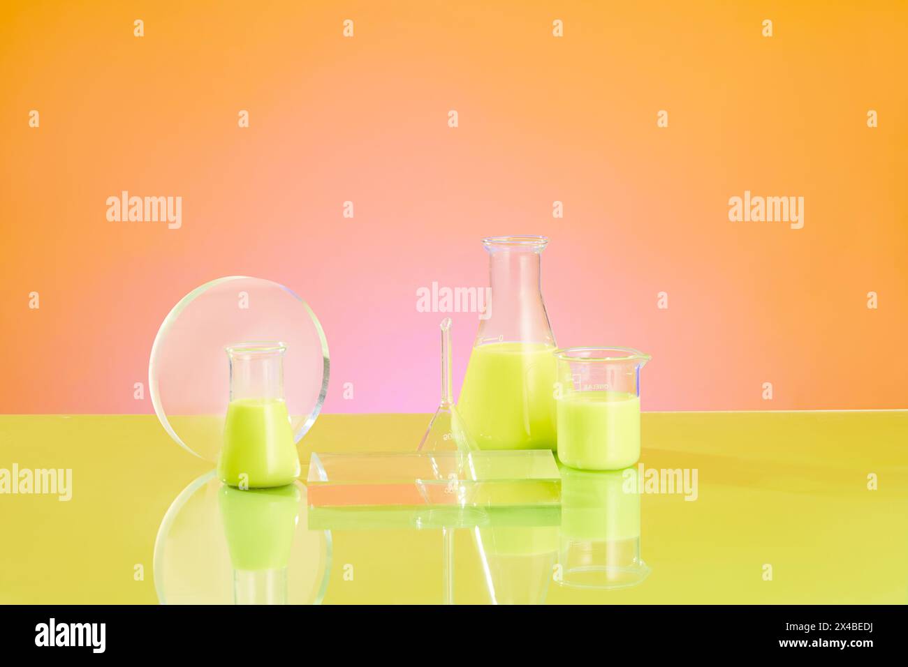 Front view of lab glassware containing green solution decorated with ...