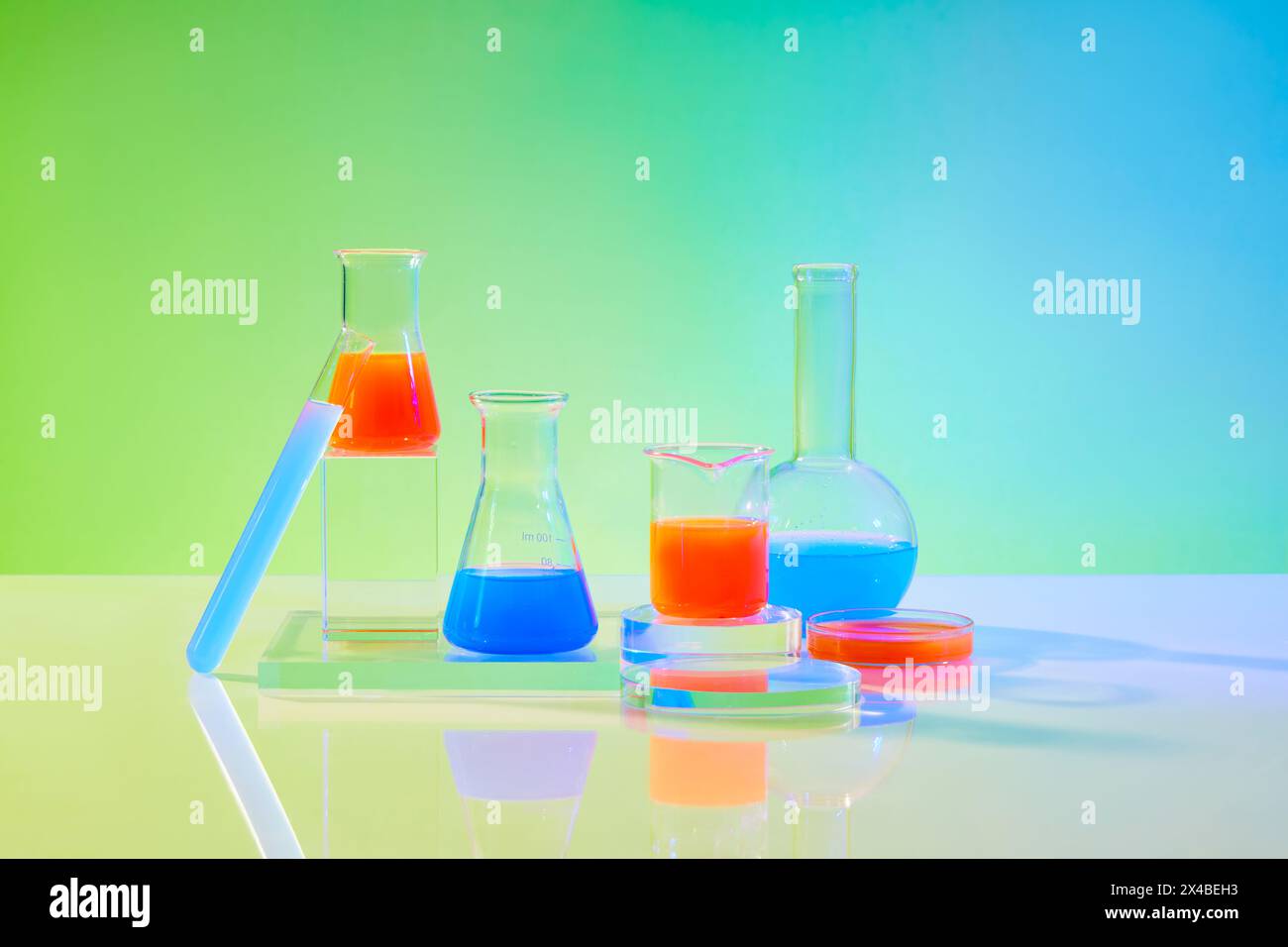 Laboratory glassware containing color liquid displayed on transparent ...