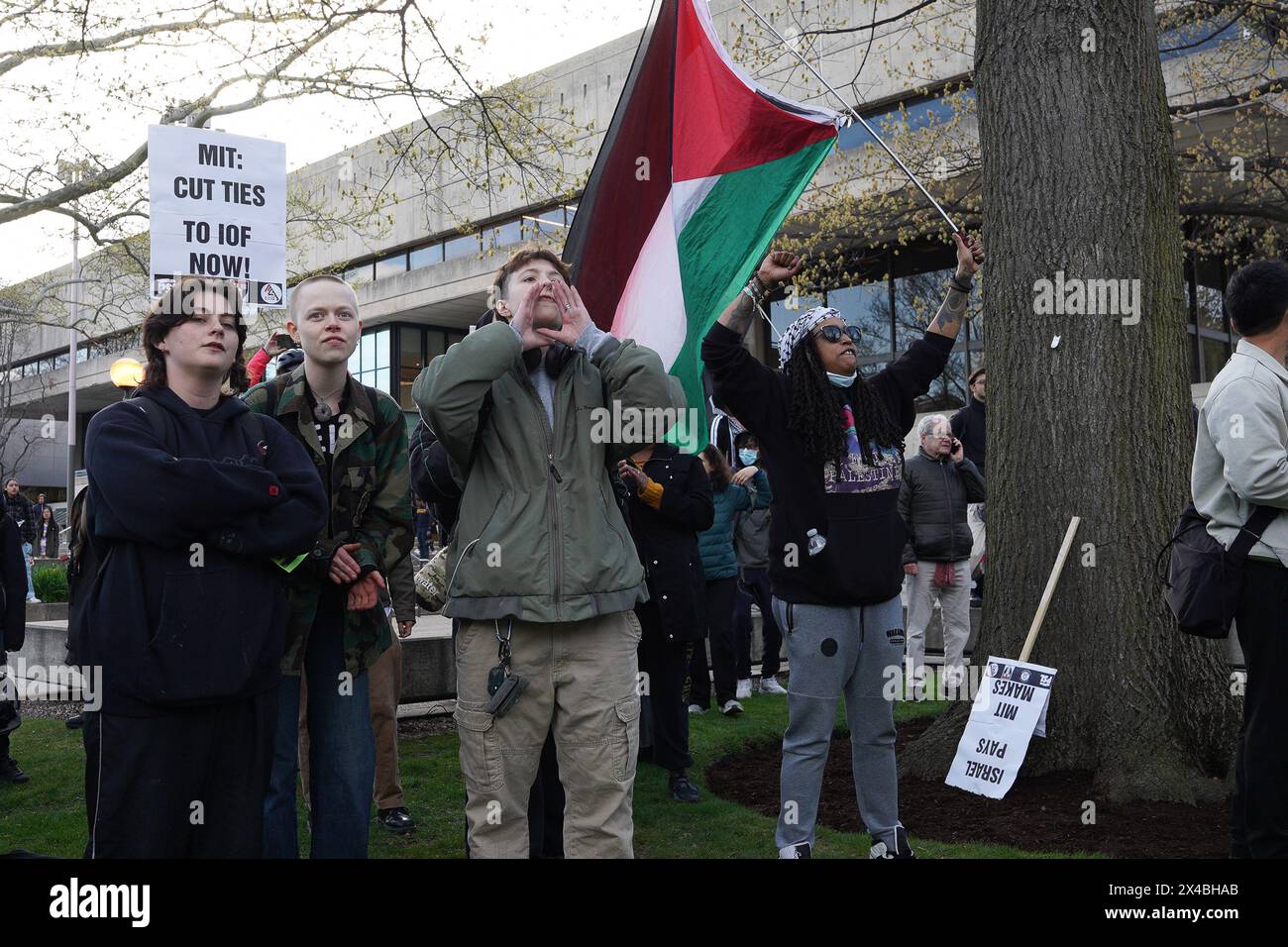 Pro-Palestine protesters repeat chants and listen to speakers at a ...