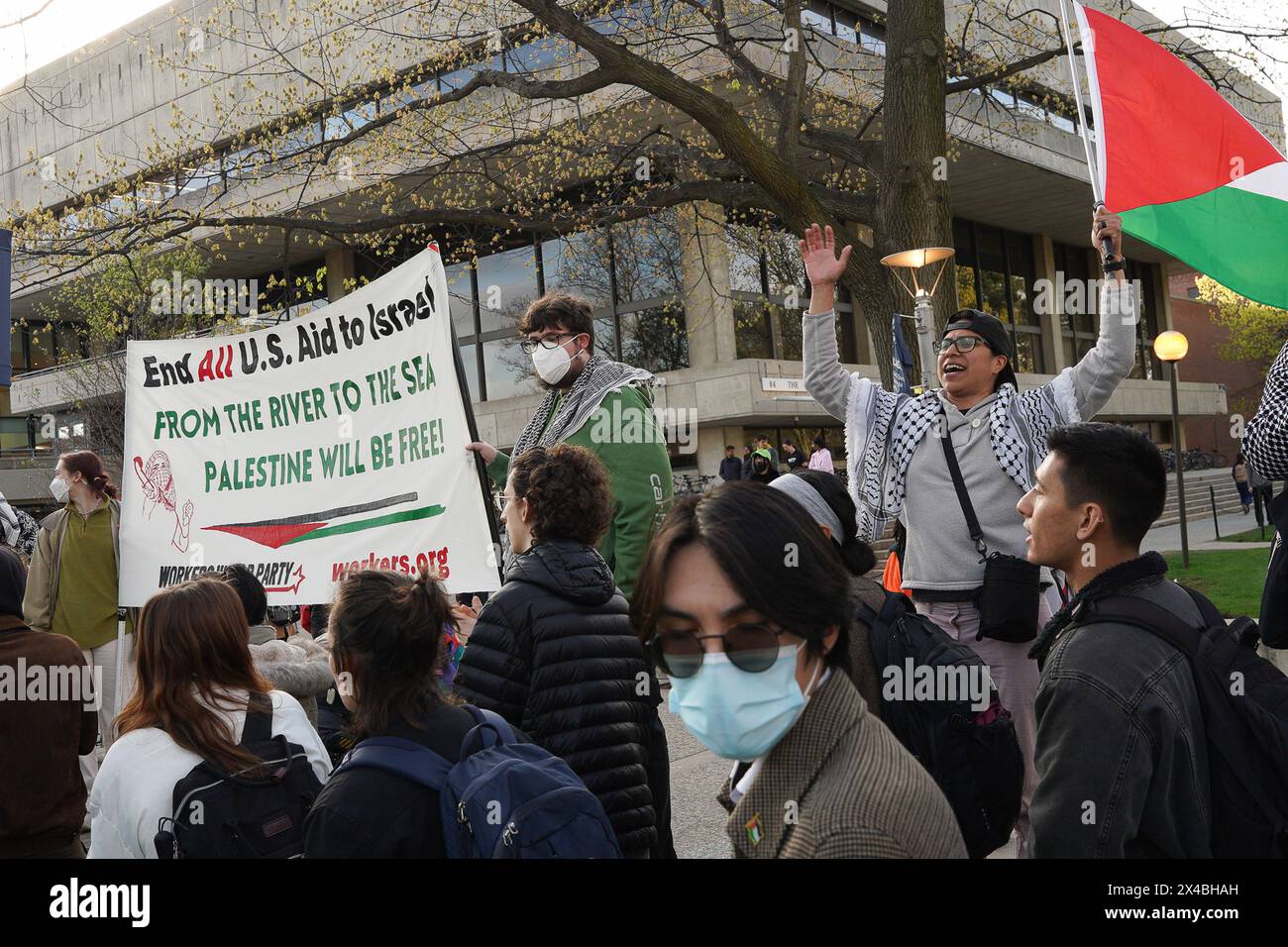 Pro-Palestine protesters repeat chants and listen to speakers at a ...