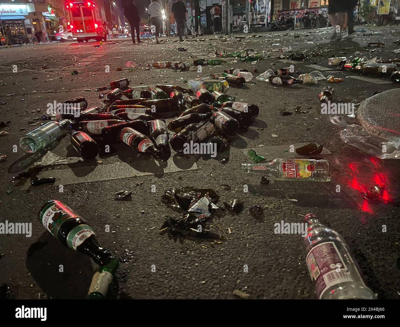 Berlin, Germany. 01st May, 2024. Empty bottles and broken glass litter ...