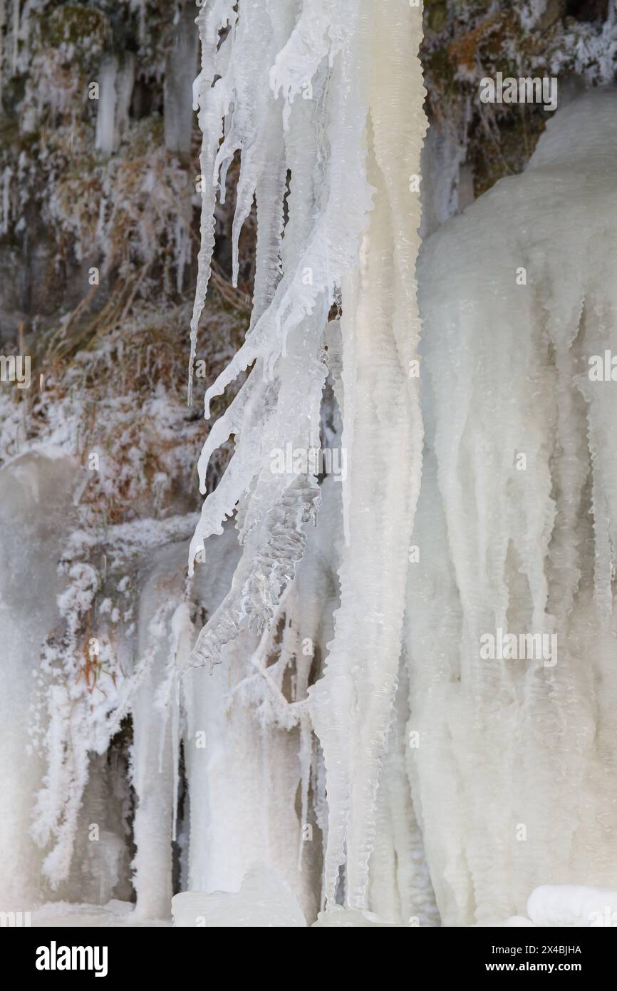 Winter waterfall frozen into icicles. Stunning frozen icicles hanging ...