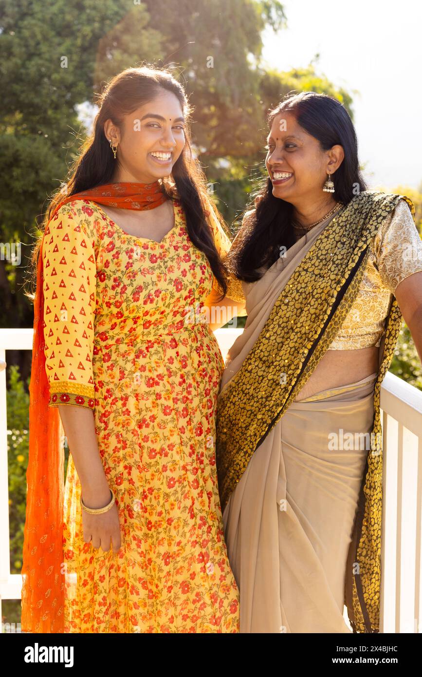 Asian mother and teenage teenage daughter, wearing traditional clothes ...
