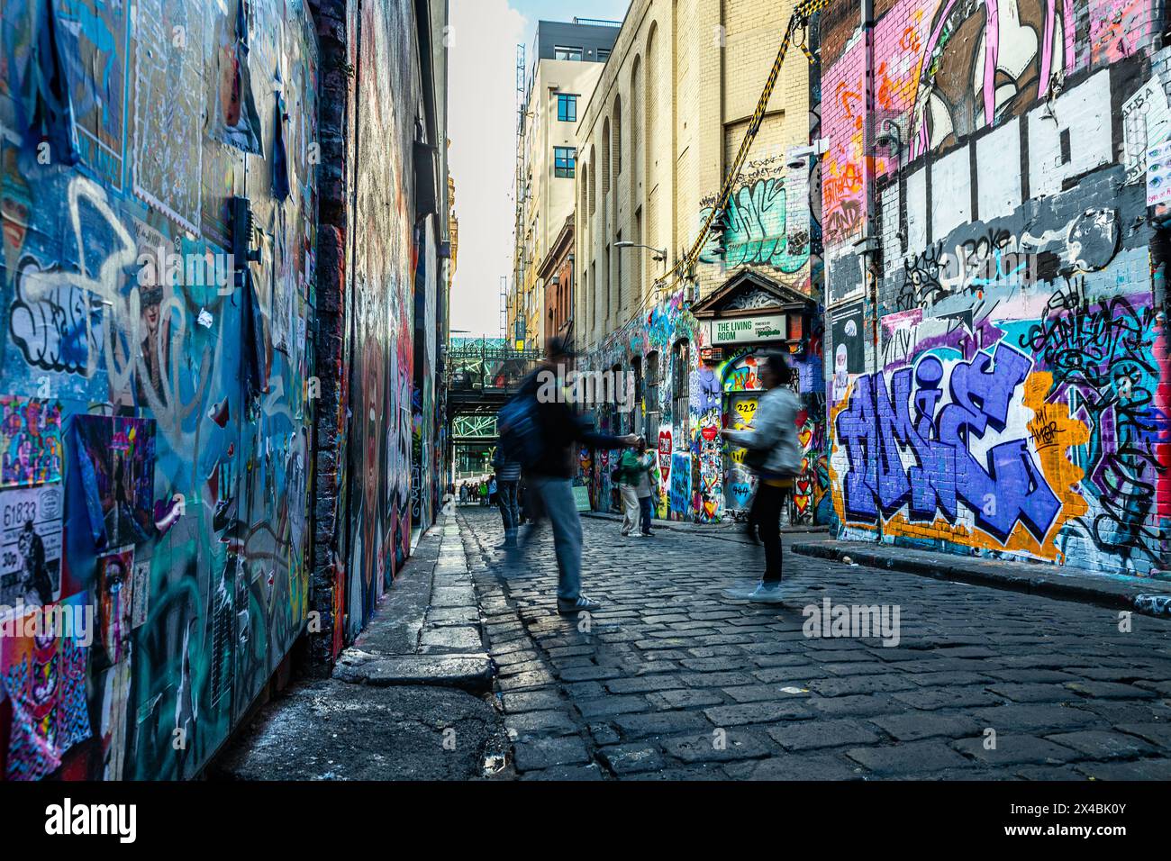 MELBOURNE, AUSTRALIA - APRIL 12, 2024: Tourists roaming in Hosier Lane ...