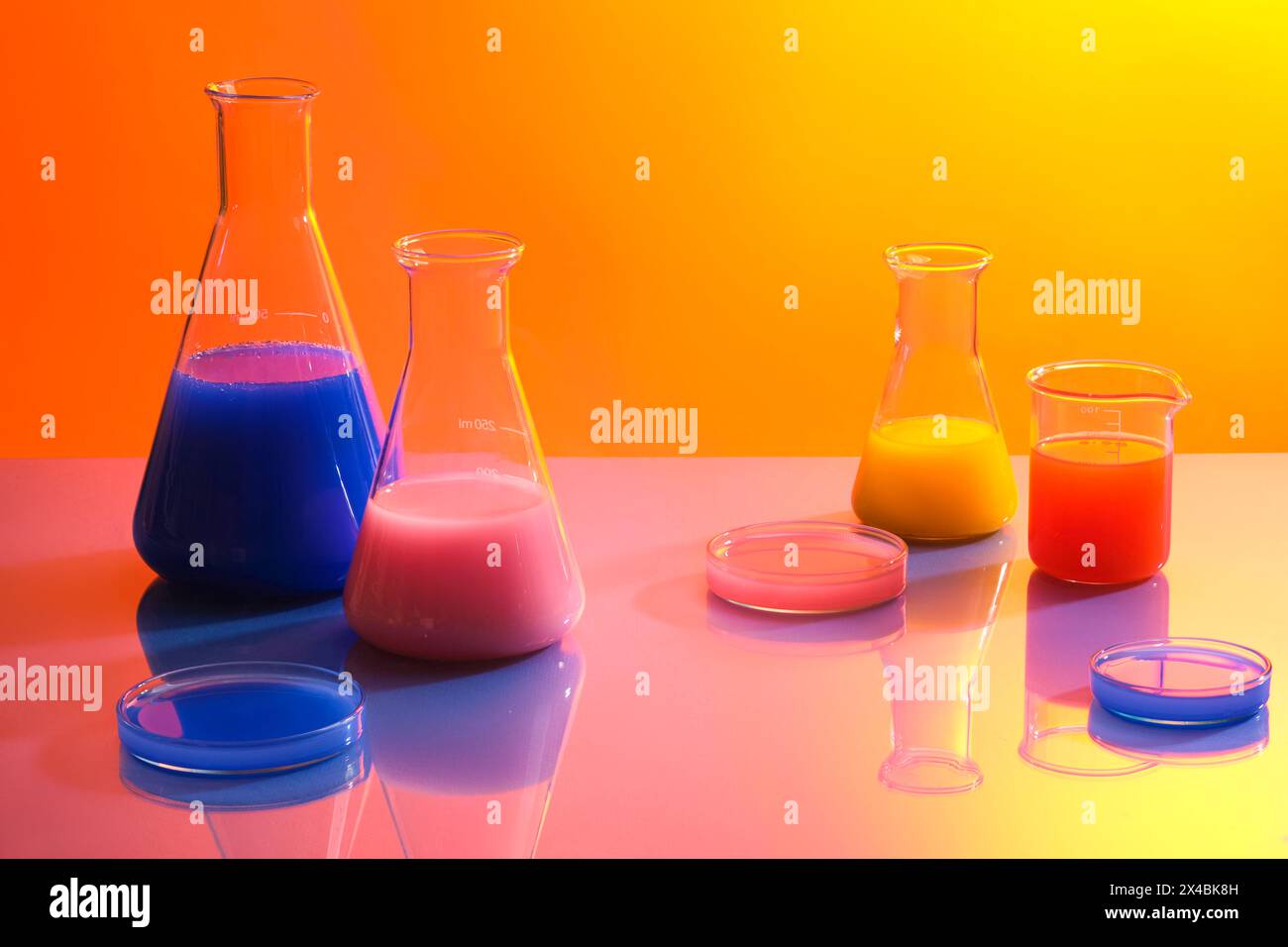 Front view of laboratory equipments: erlenmeyer flasks, beaker and ...