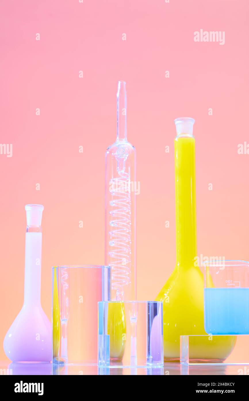 Assorted laboratory equipment showcase on pink gradient background. Lab ...