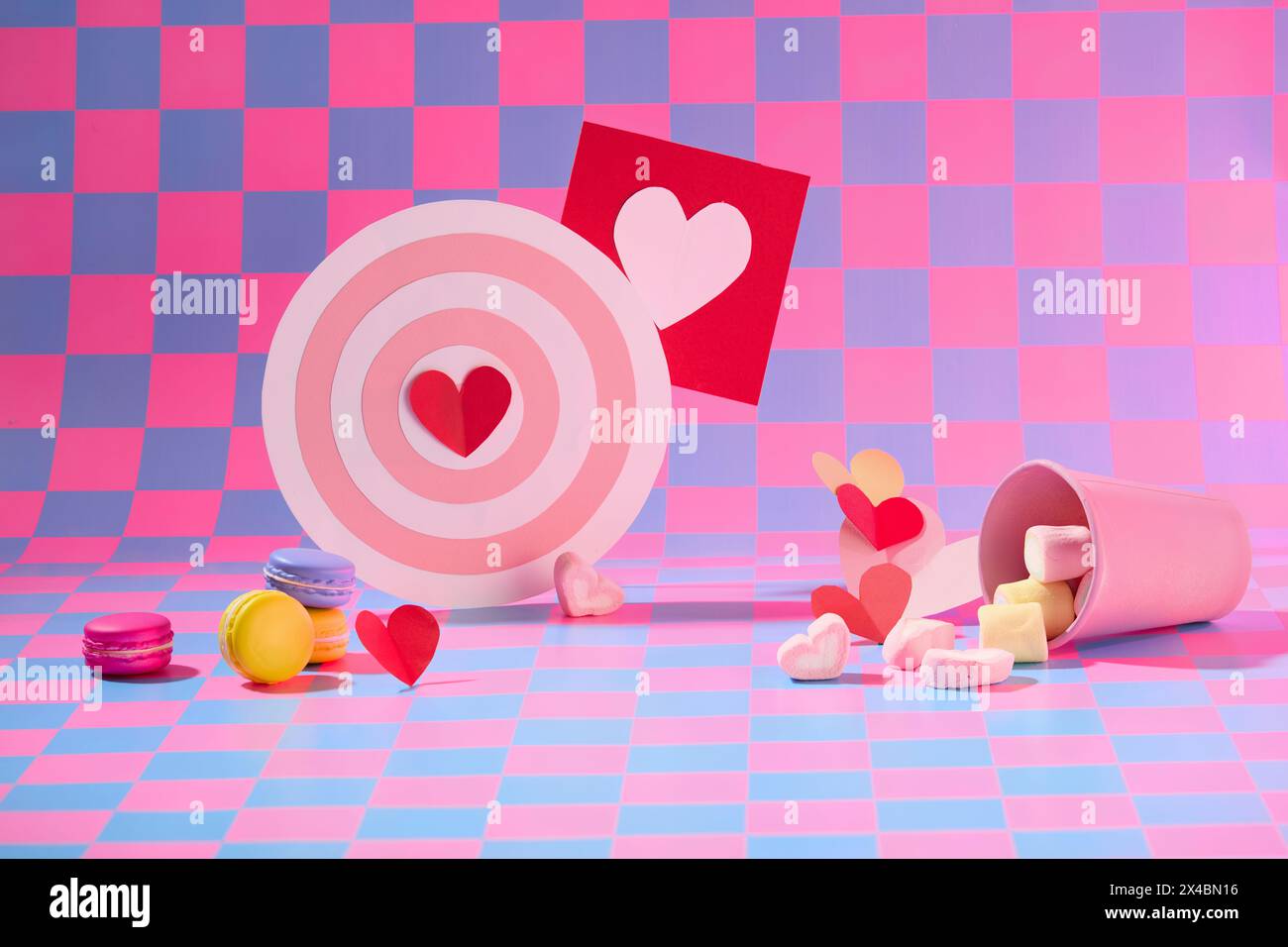 On purple and pink checkered background, sweet cakes, marshmallow and ...