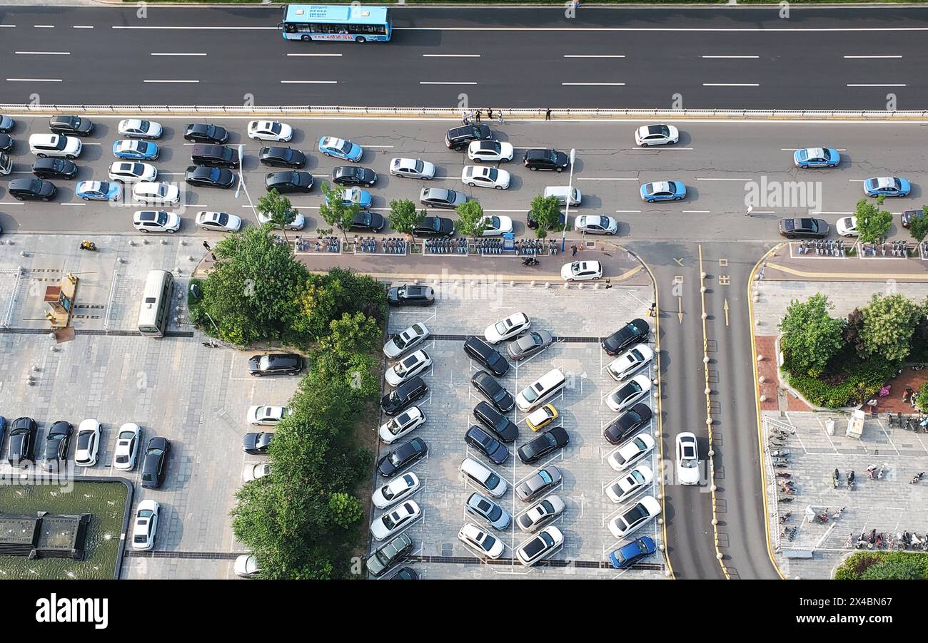 Aerial View of Busy Urban Parking Lot During Daytime Rush Hour ...