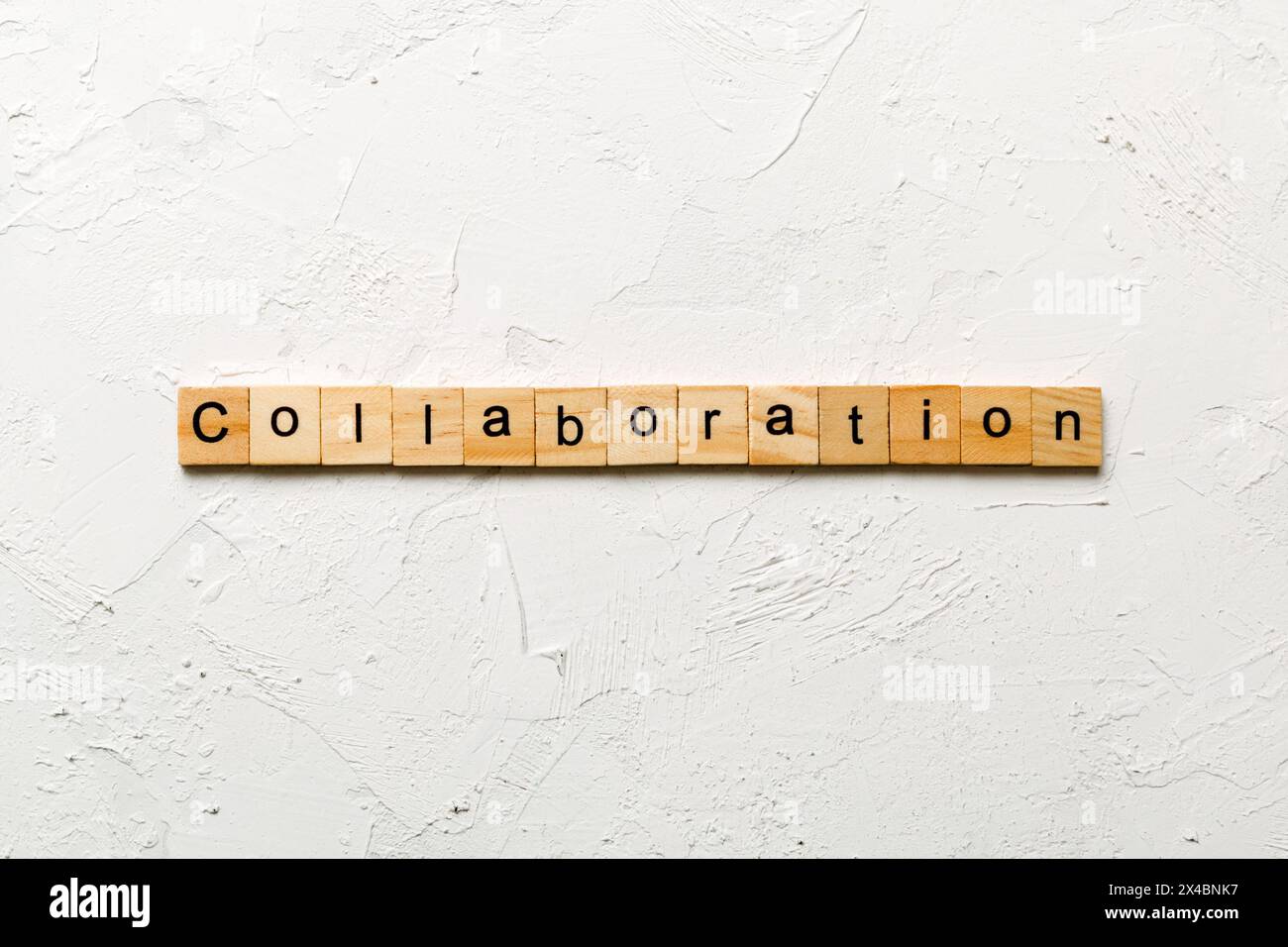 Collaboration word written on wood block. Collaboration text on cement ...