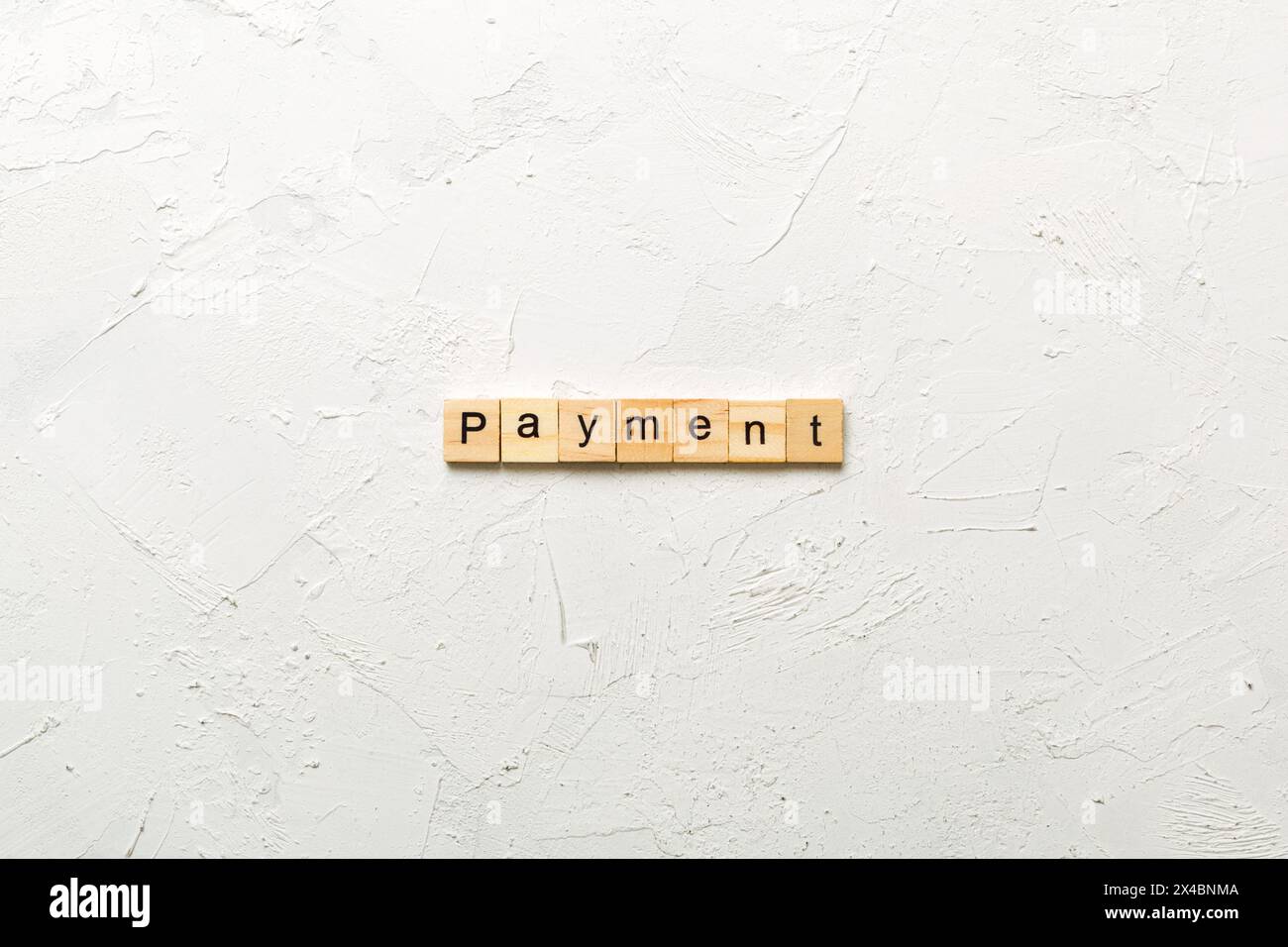 Payment word written on wood block. Payment text on cement table for ...