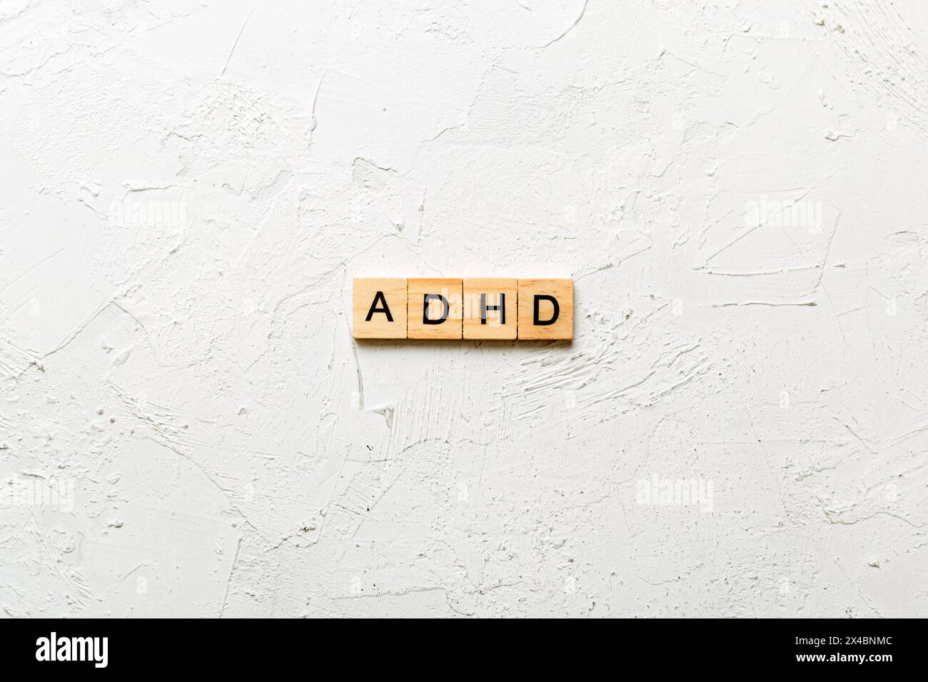 ADHD word written on wood block. ADHD text on table, concept Stock ...