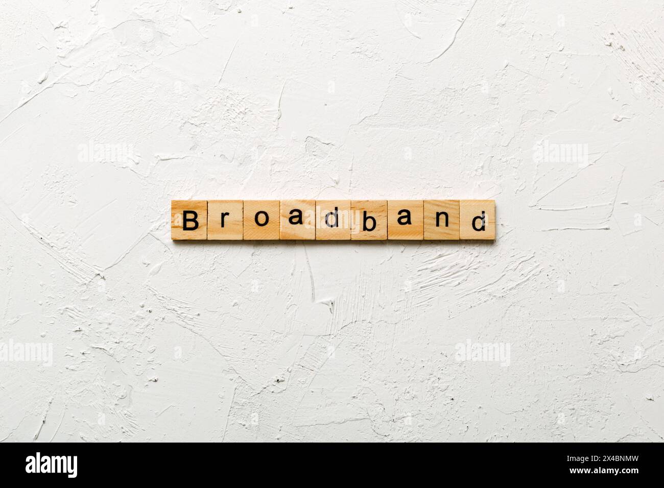 BROADBAND word written on wood block. BROADBAND text on cement table ...