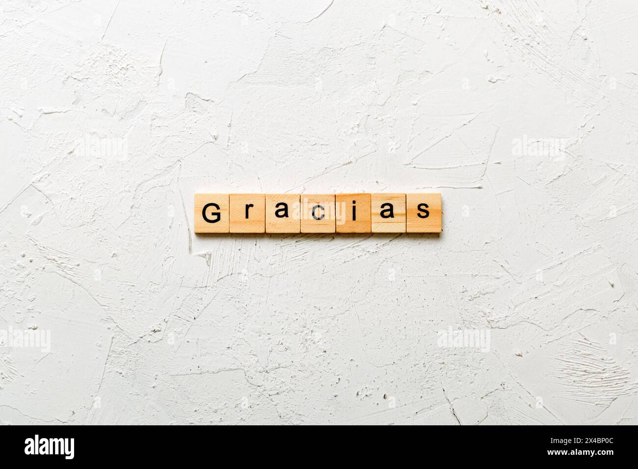 gracias word written on wood block. gracias text on table, concept ...