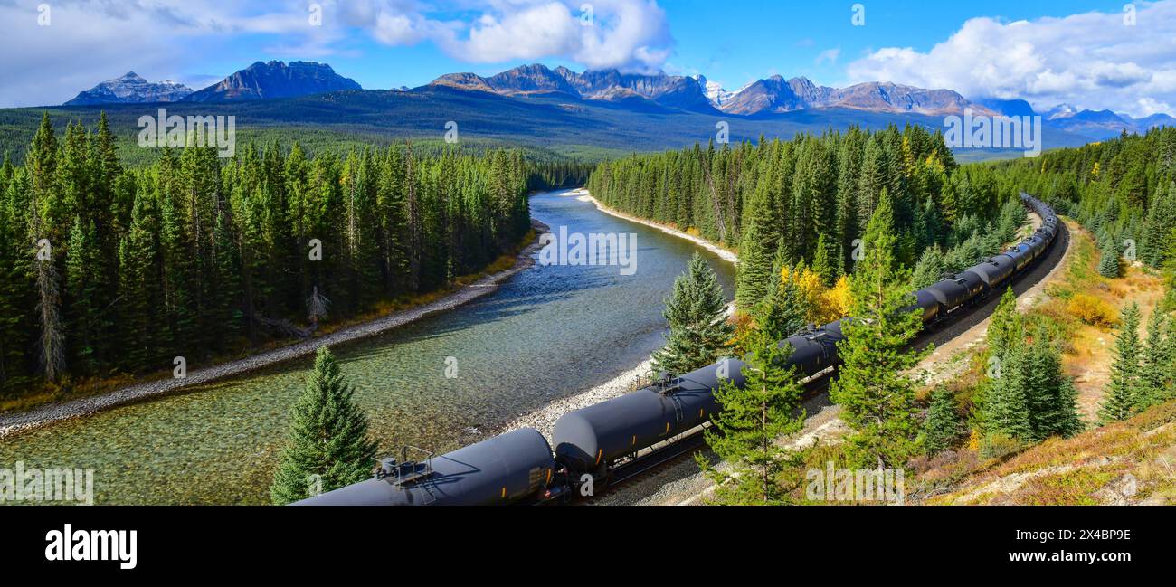 Freight train moving along Bow river in Canadian Rockies ,Banff National Park, Canadian Rockies ...