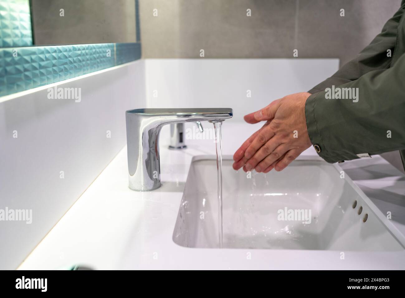 Hands Washing Hands Under Modern Faucet Close up Stock Photo - Alamy