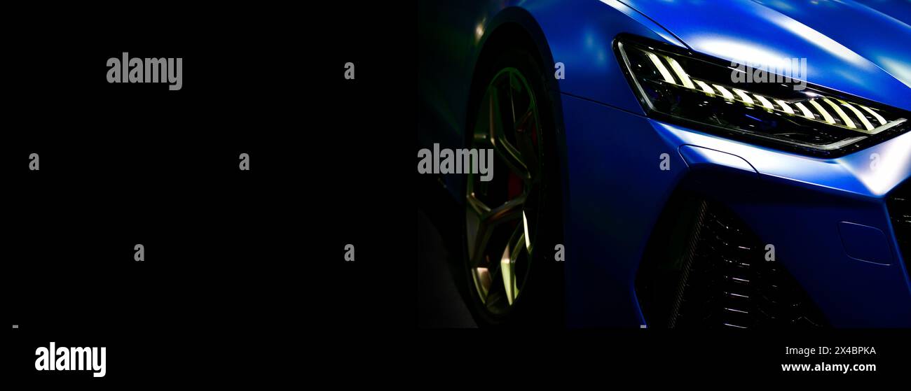 Front view of the LED headlights modern blue car , copy space Stock ...