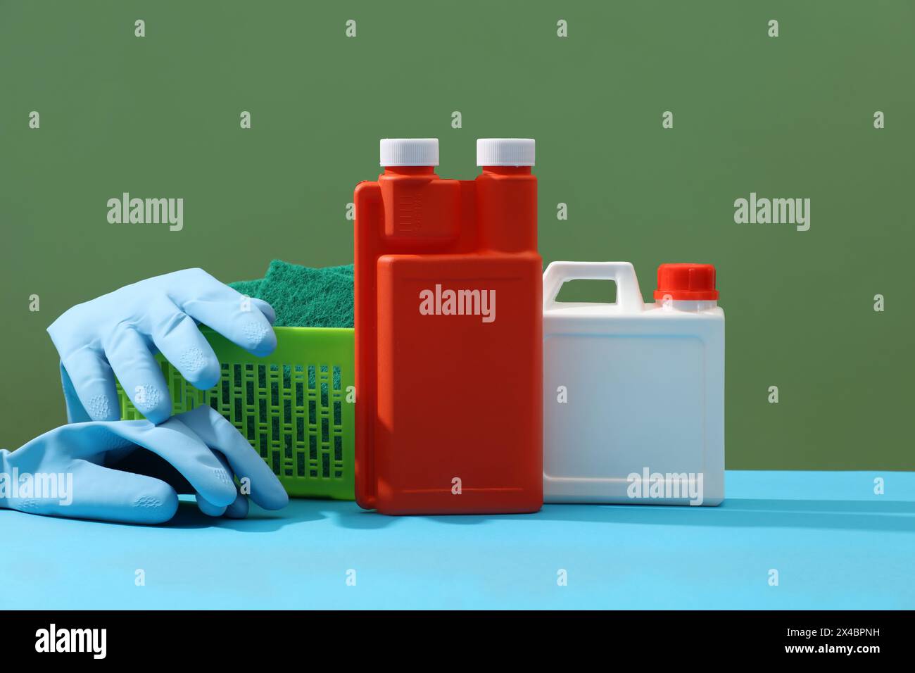 Red and white plastic bottle unlabeled displayed with basket with ...