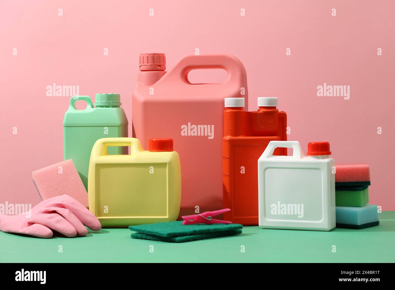 House cleaning plastic product on pink background. All-purpose cleaning ...