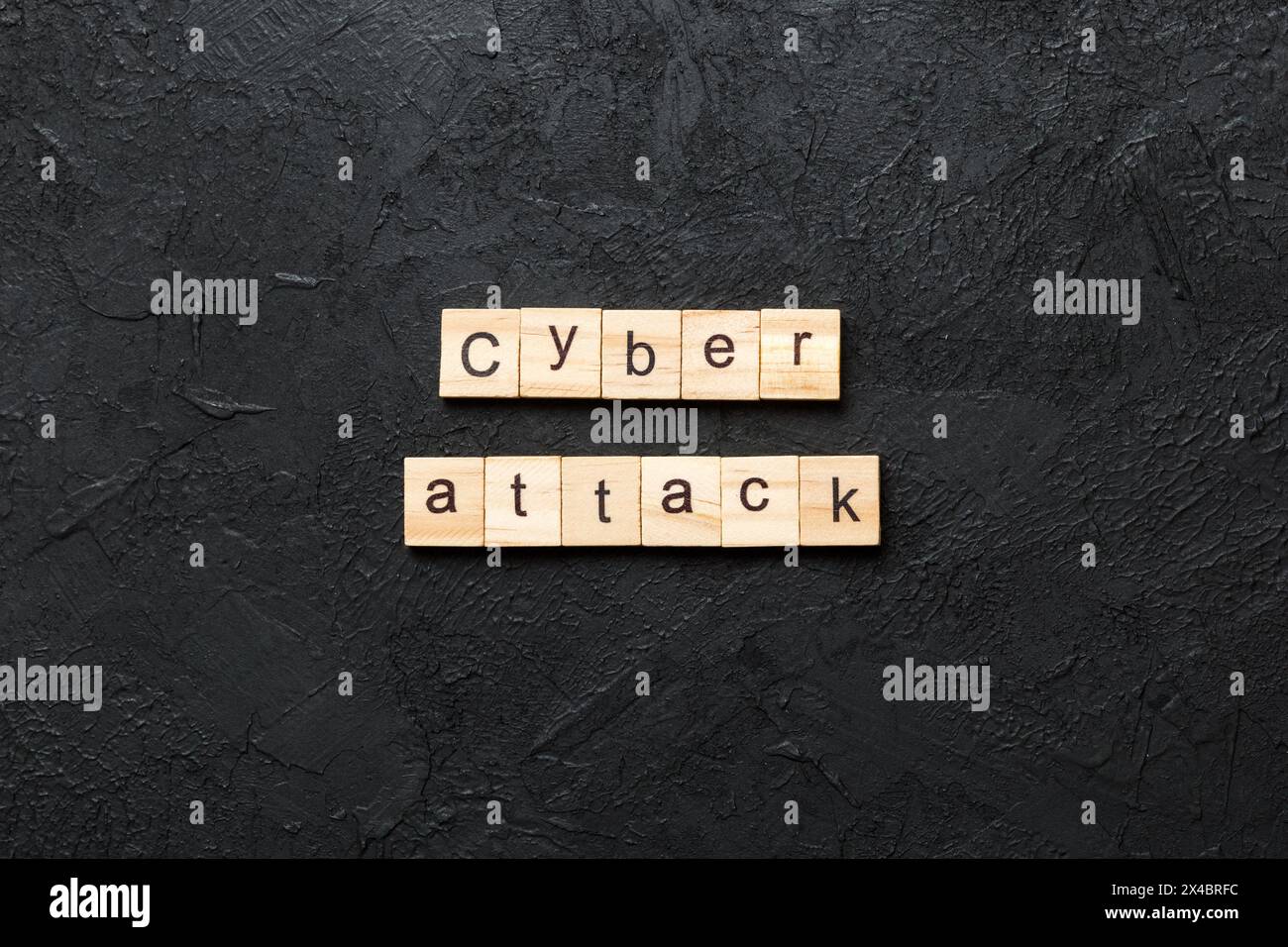 Cyber attack word written on wood block. Cyber attack text on cement ... Cyber attack word written on wood block. Cyber attack text on cement ...