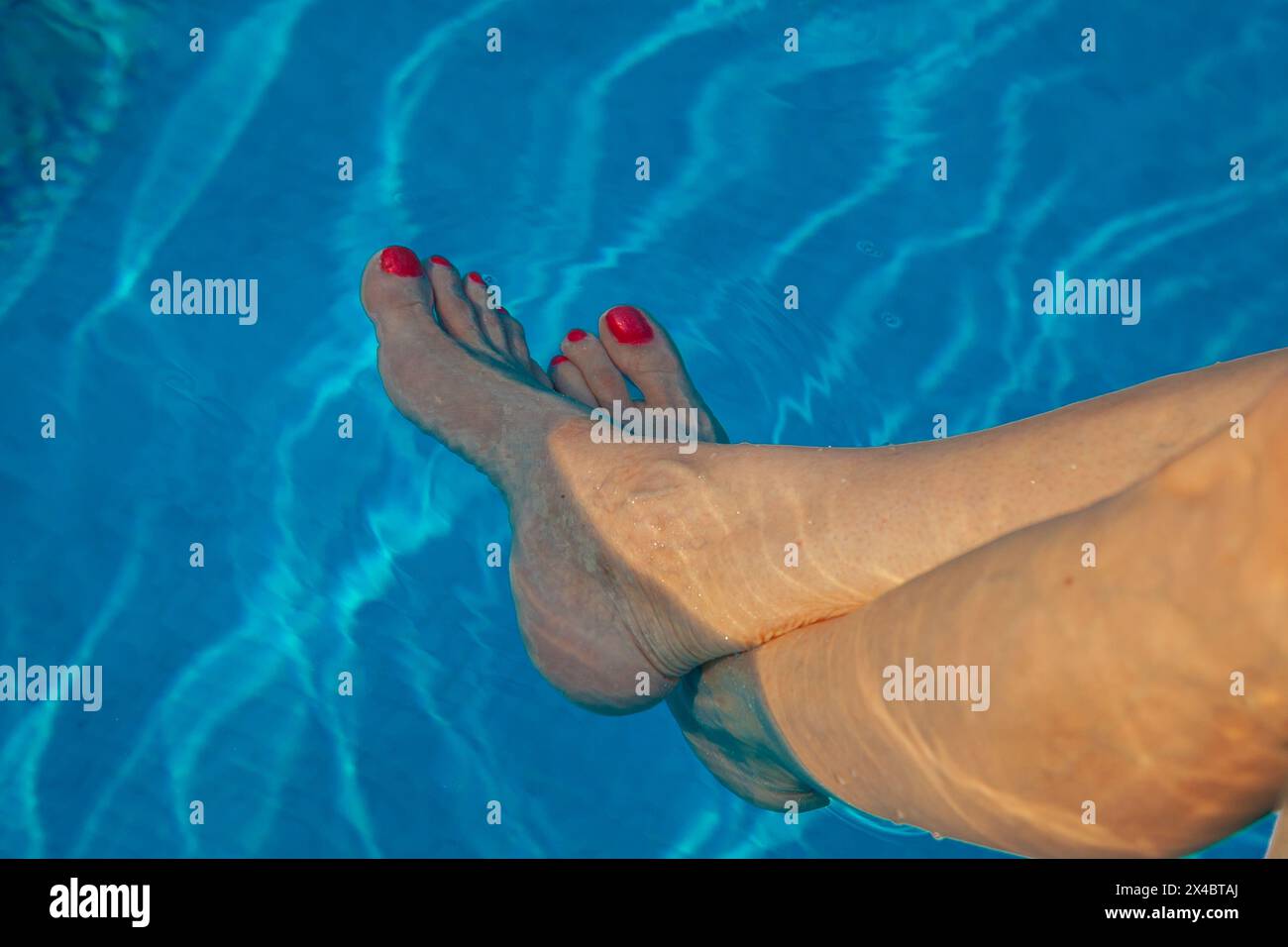 Wet toes with red nail polish hi-res stock photography and images - Alamy
