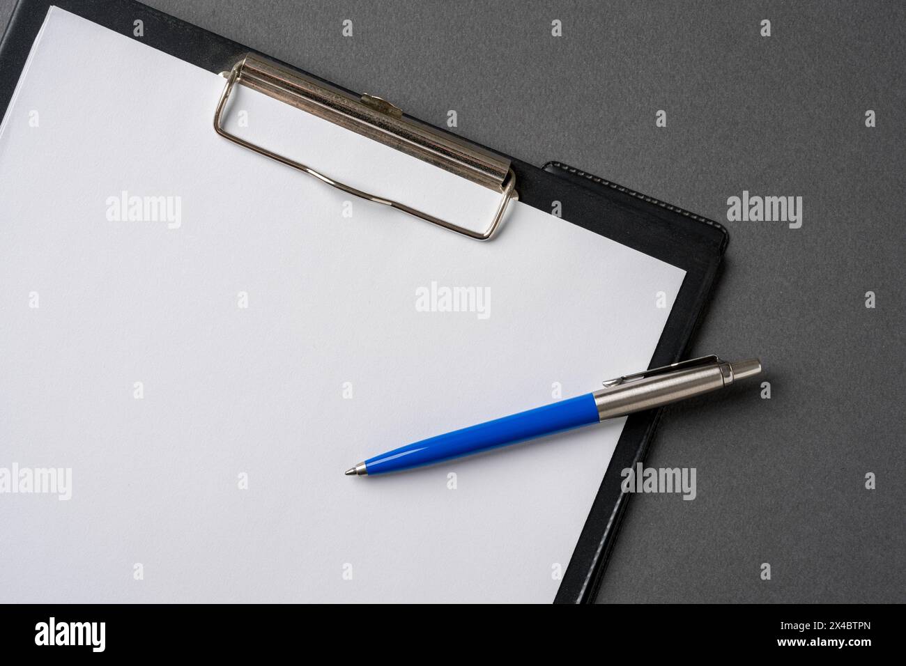 Blank A4 paper attached to the clipboard and ballpoint pen on it Stock ...