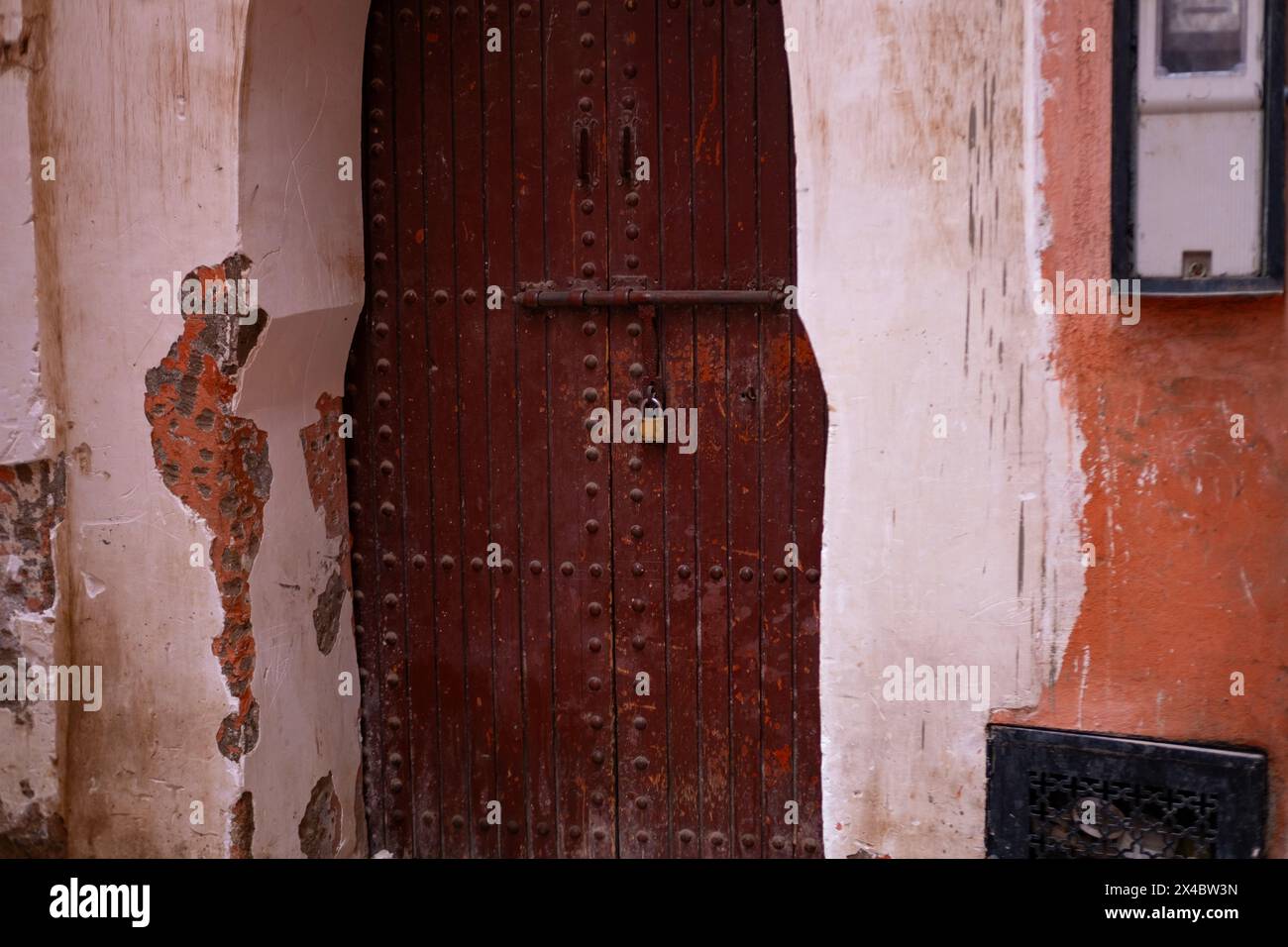 old fortress wall with gate, Authentic details traditional Moroccan ...