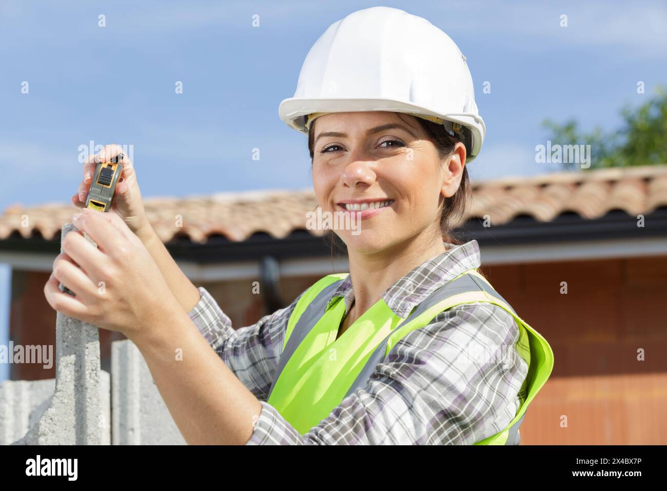 Builder measuring concrete blocks construction hi-res stock photography ...