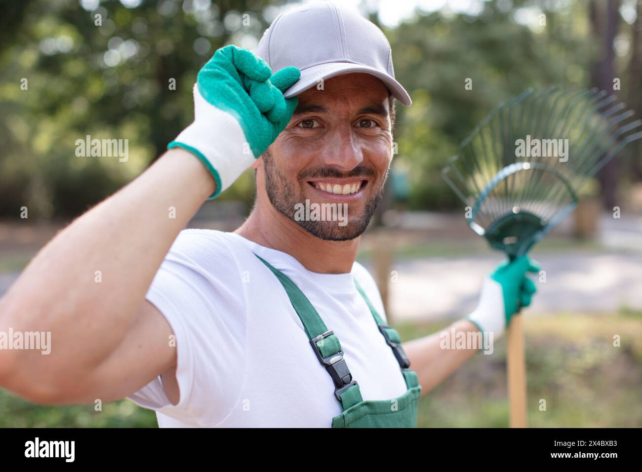 Professional male worker rake tool hi-res stock photography and images ...