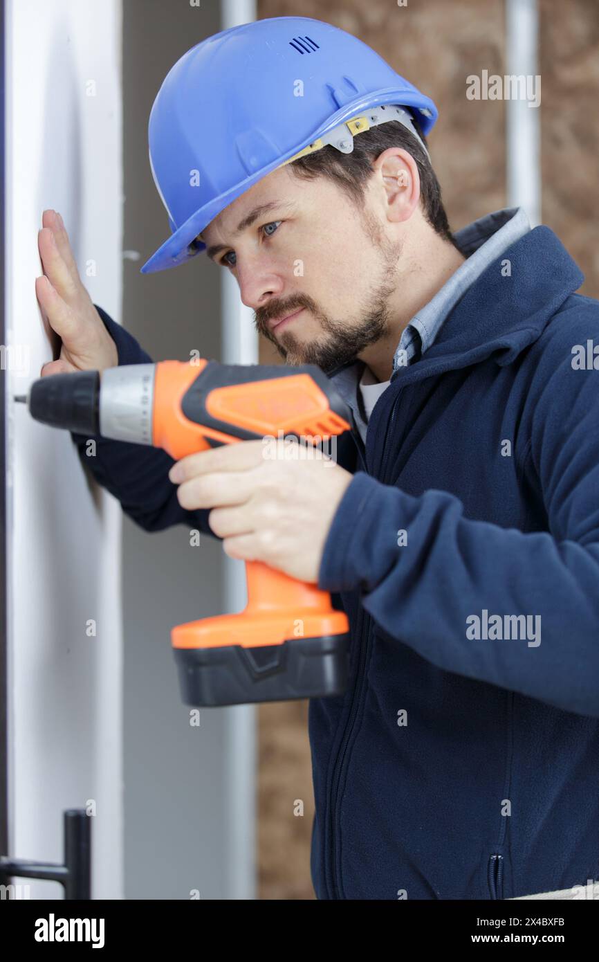 male builder using cordless drill Stock Photo - Alamy