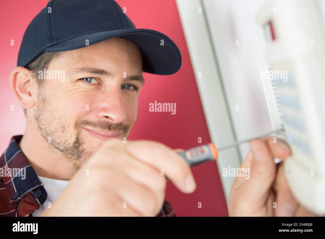 an air con maintenance man Stock Photo - Alamy