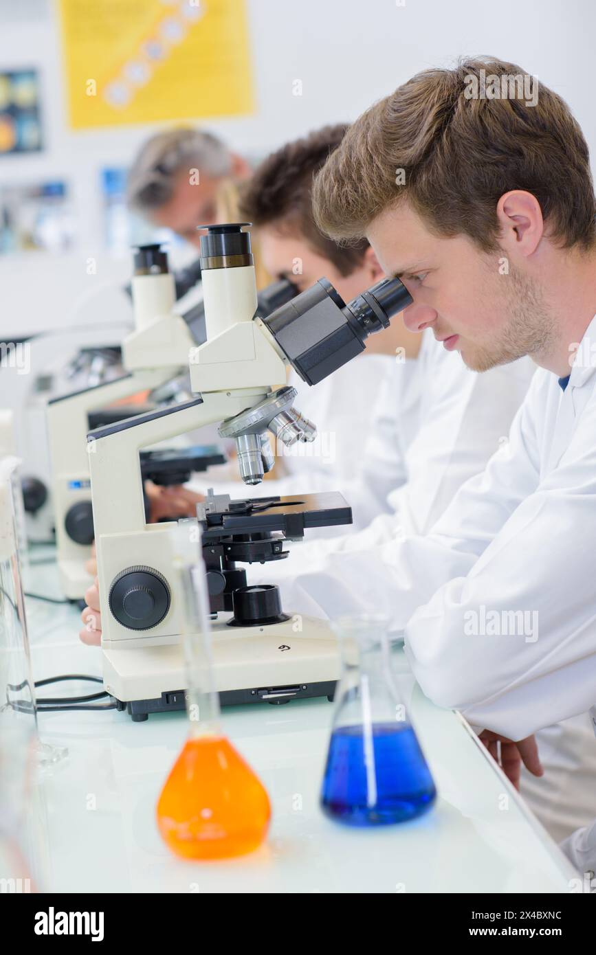 student looking through the microscope Stock Photo - Alamy