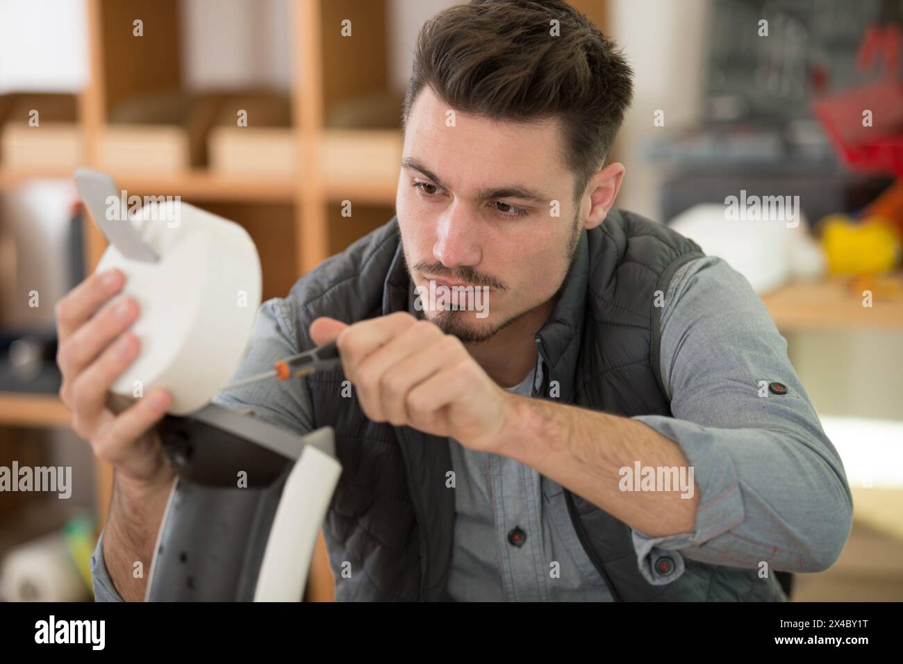 Man fixing coffee machine hi-res stock photography and images - Alamy