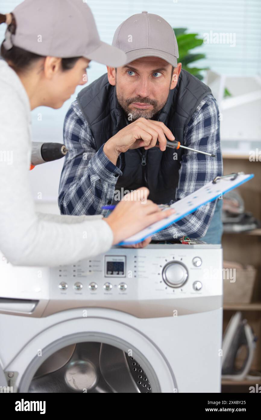 washing machine repair service concept Stock Photo - Alamy