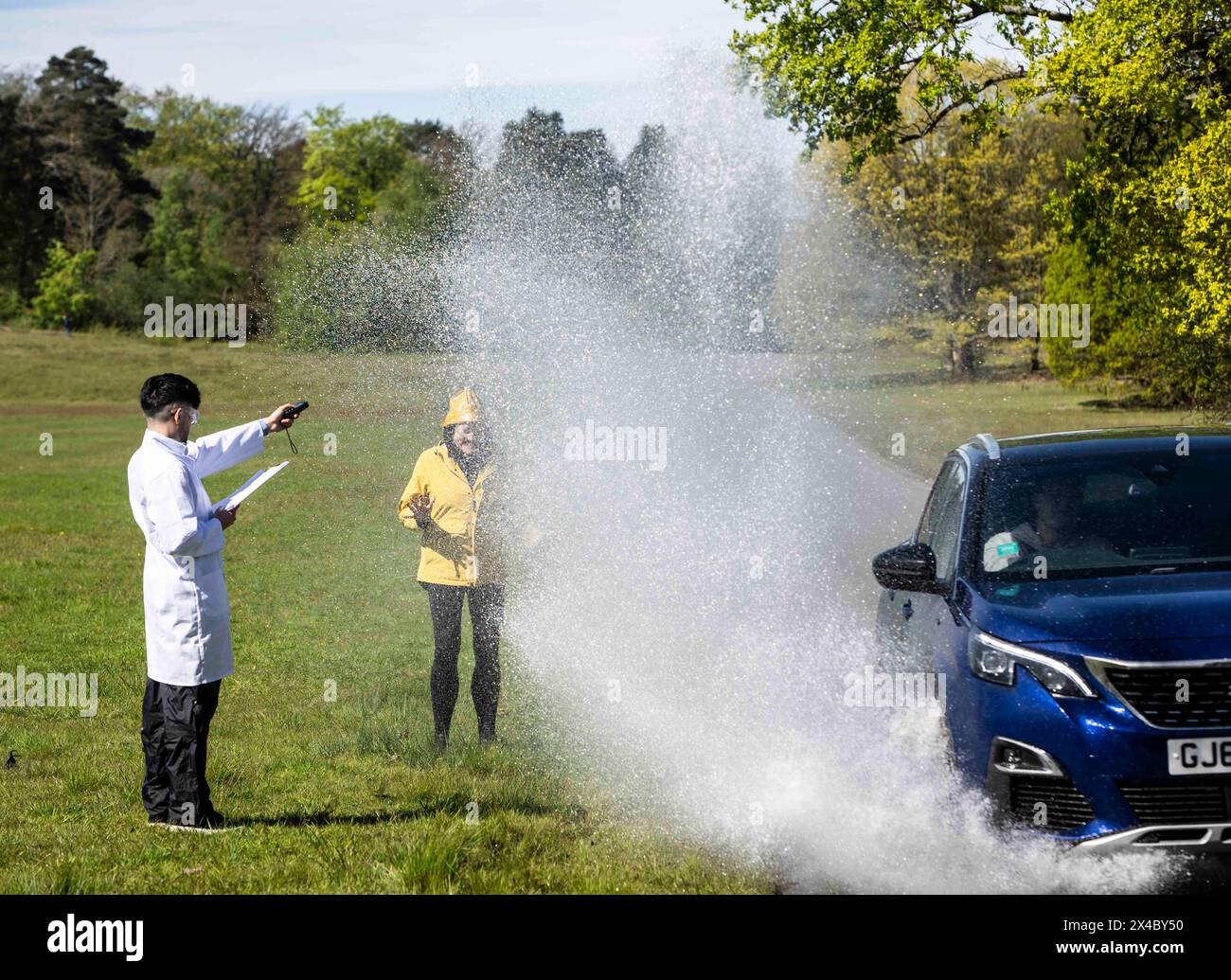 EDITORIAL USE ONLY Inspectors measure the size of splashes made by a ...