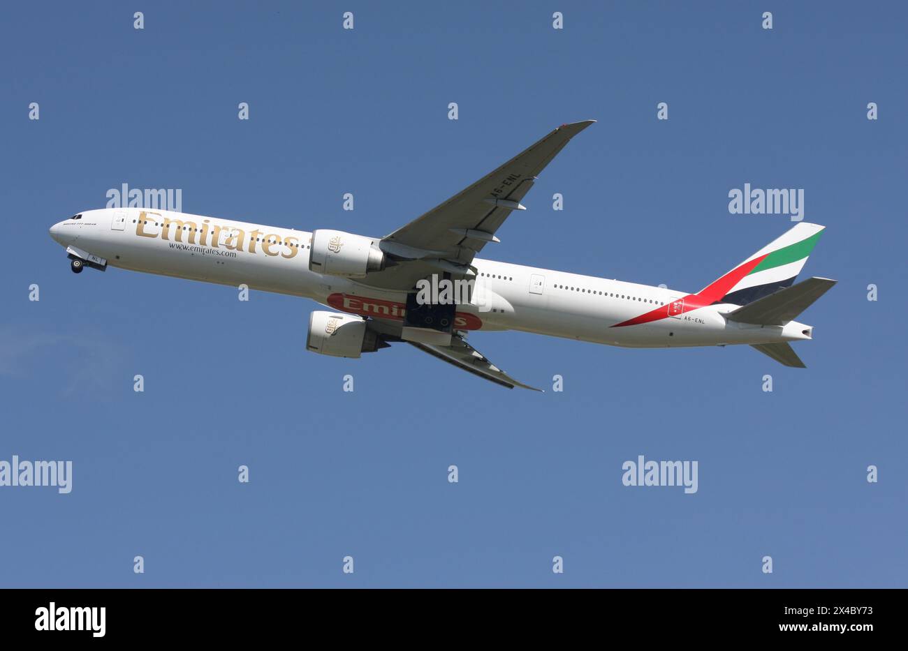 A Boeing 777-300 of Emirates departing London Gatwick Airport Stock ...