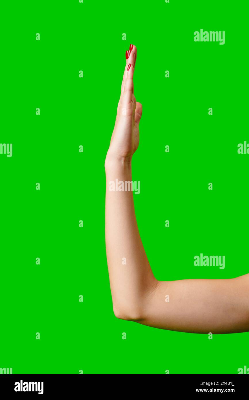 Womans Arm Hand Sign Raised in the Air Stock Photo - Alamy