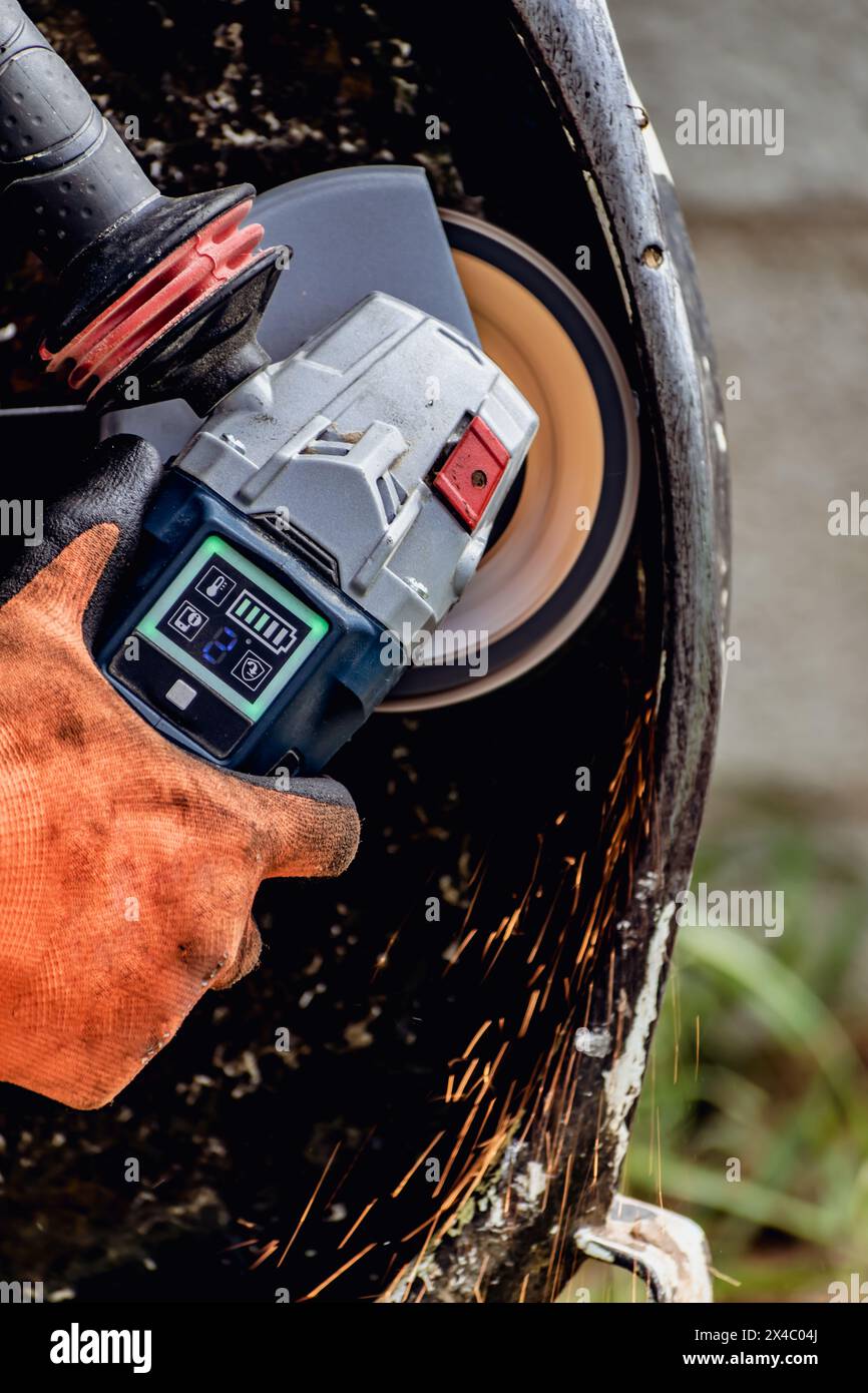 Man using portable grinder hi-res stock photography and images - Alamy