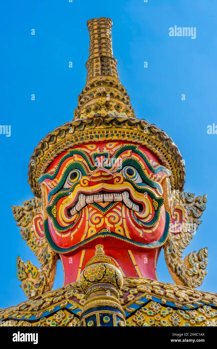 Red guardians statue, Grand Palace, Bangkok, Thailand. Palace was home ...