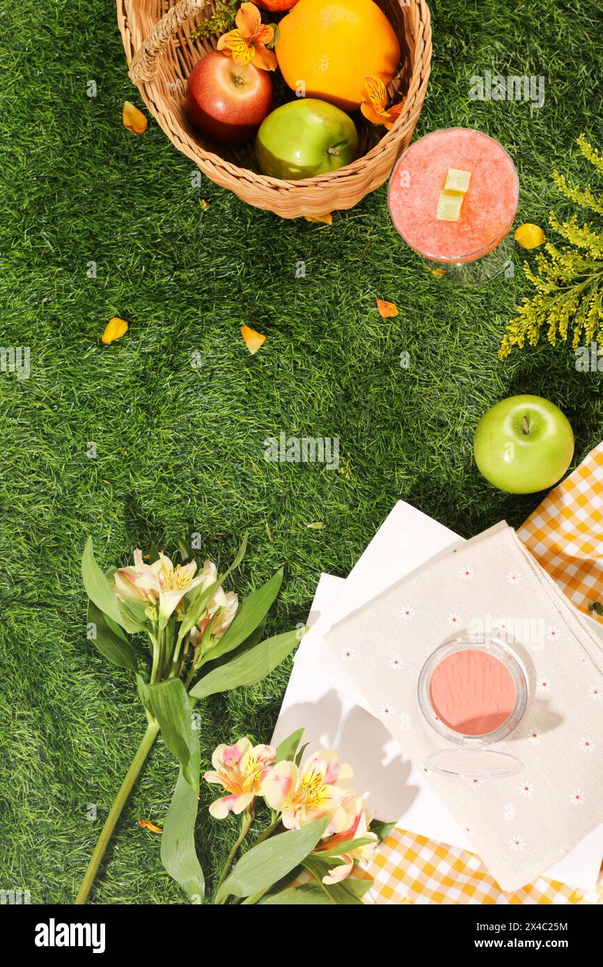 Hello summer concept with basket of fruits, smoothies cups, fresh ...