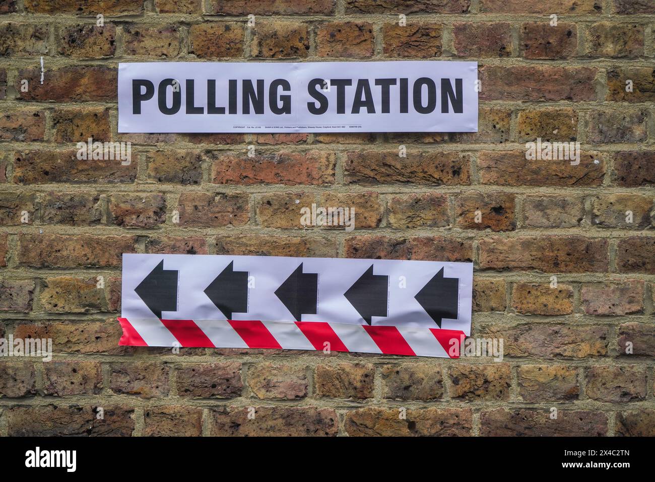 A sign points to to the polling station in London Stock Photo - Alamy