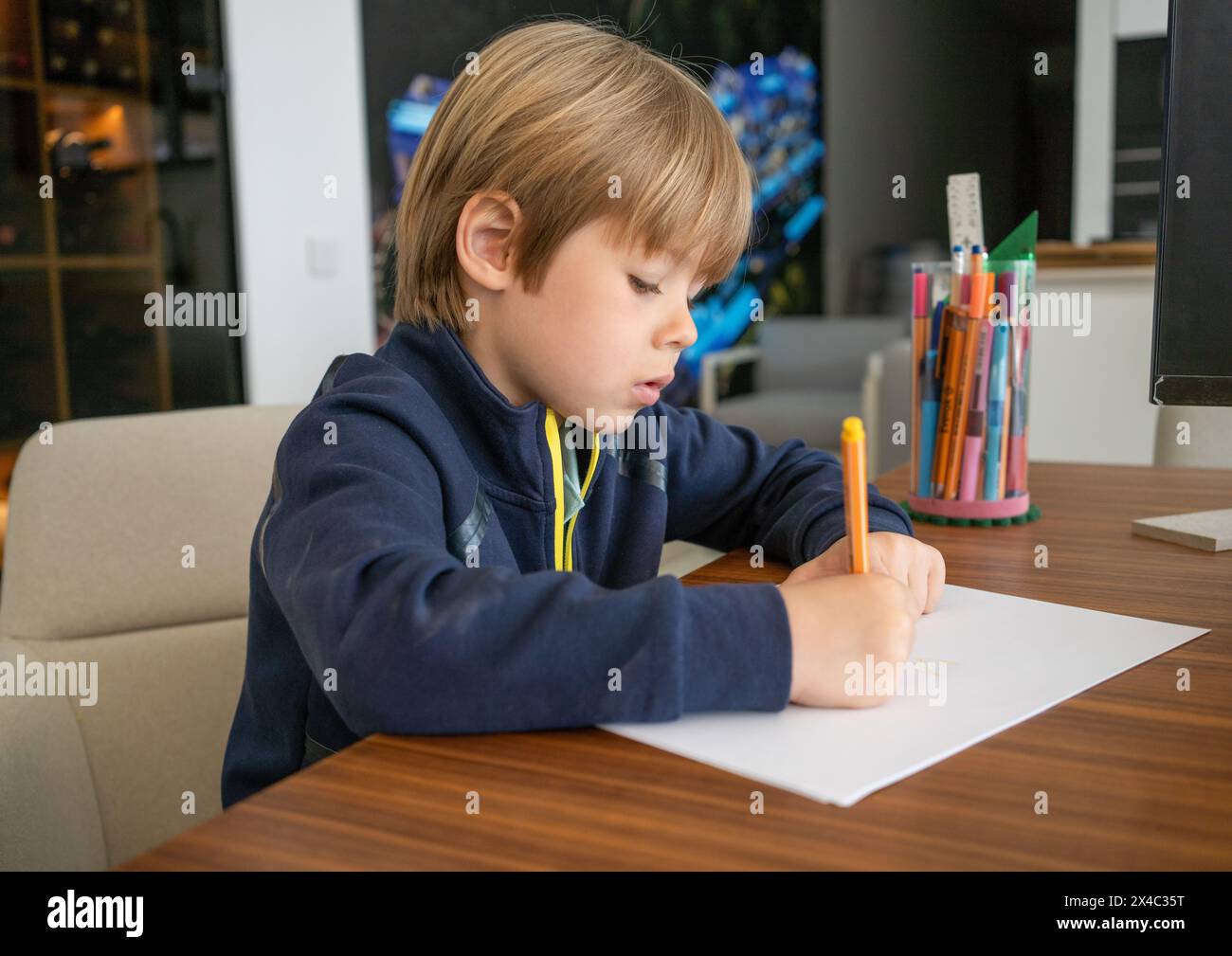Happy little boy drawing with pencils at home having fun Stock Photo ...
