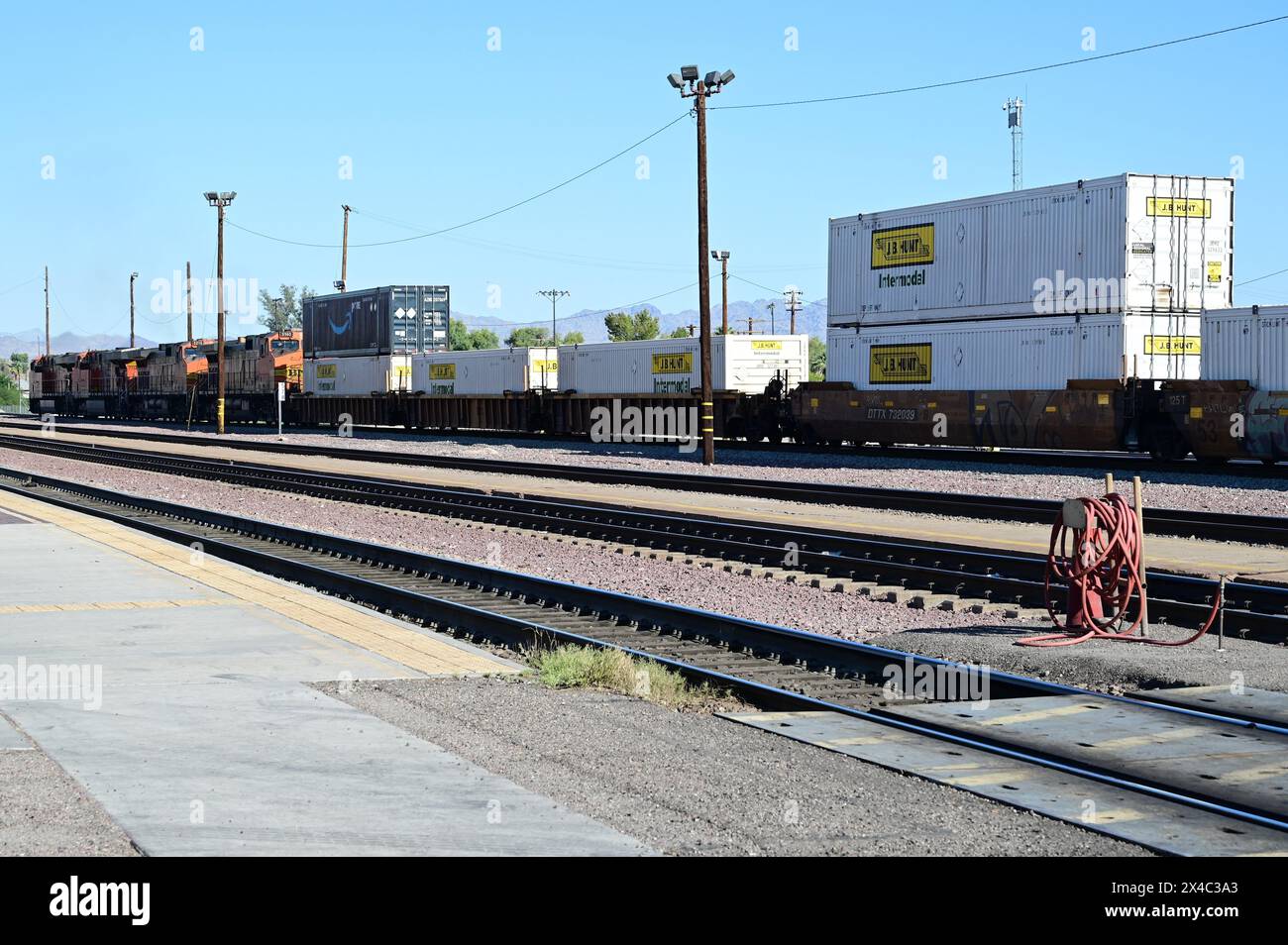 Freight train passing through the Needles railway station Stock Photo ...