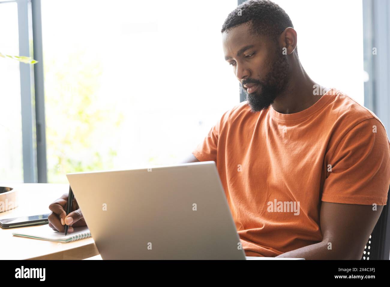 Professional male focusing intently working hi-res stock photography ...
