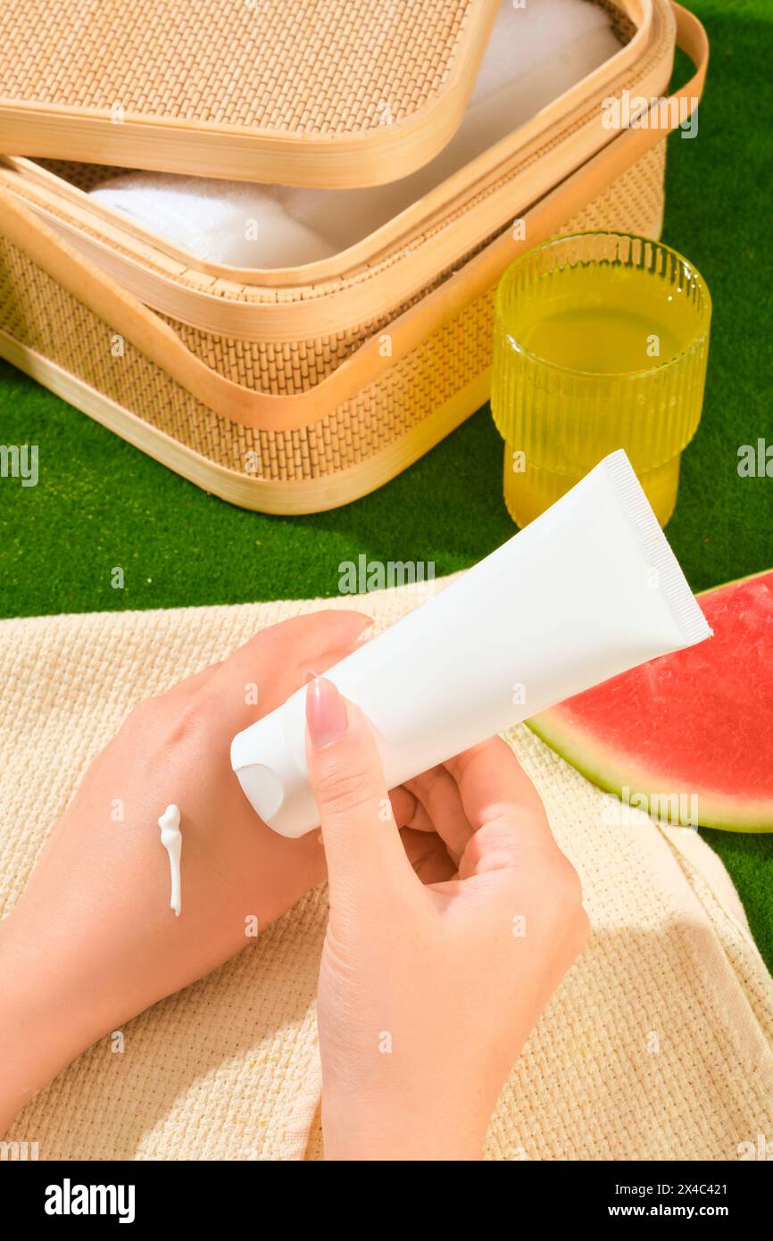 On a green grass background with picnic basket, glass juice and fruit ...