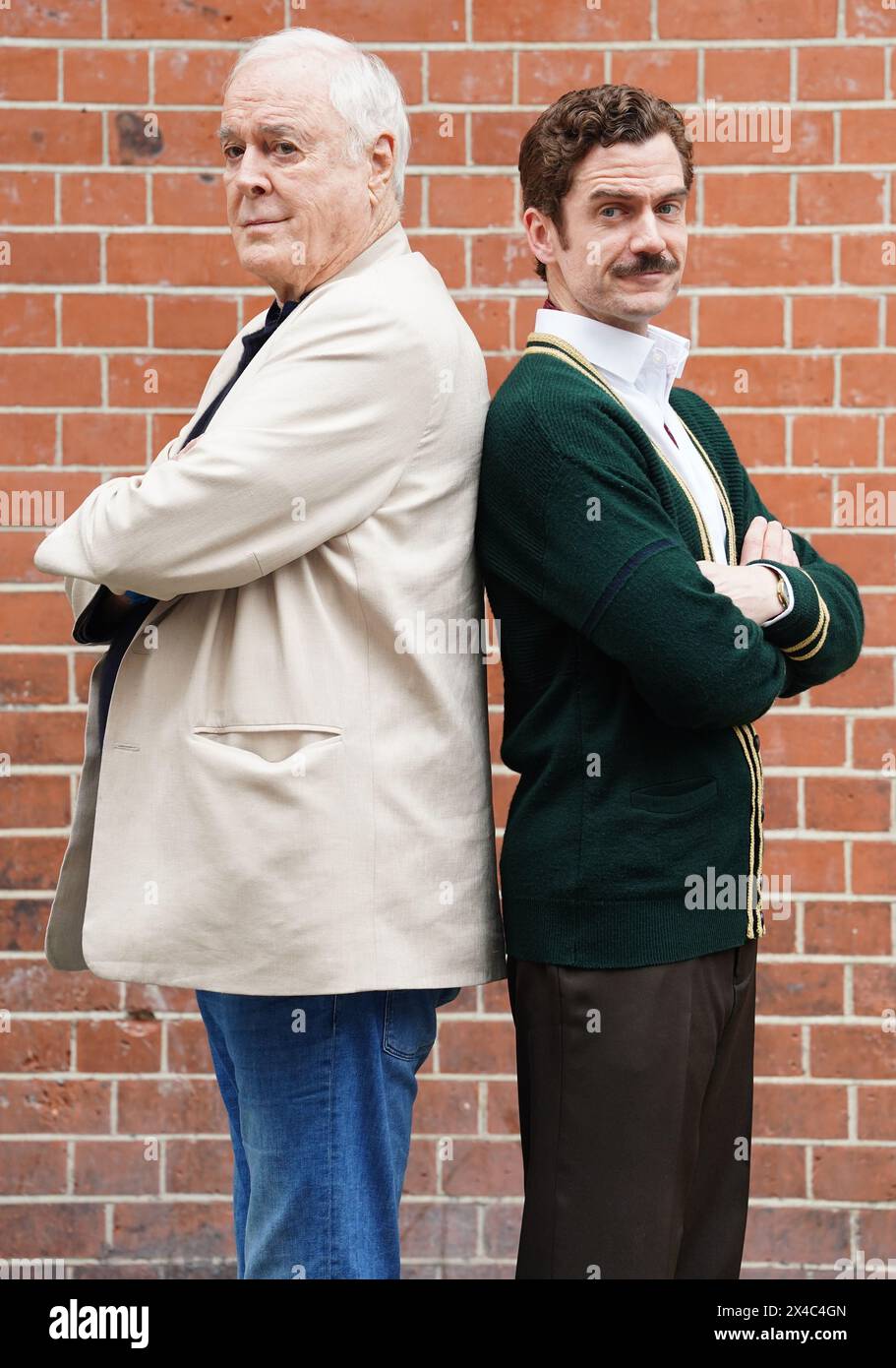John Cleese with Adam Jackson-Smith as Basil Fawlty pose before a Q&A ...