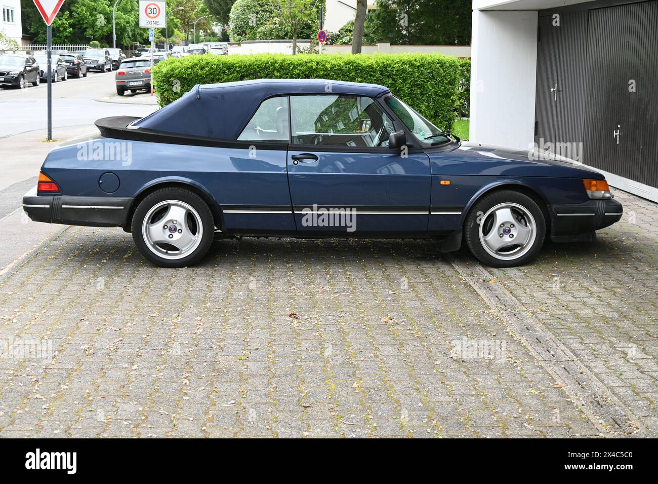 Cologne, Germany. 28th Apr, 2024. A blue Saab 900 S Cabriolet is parked ...