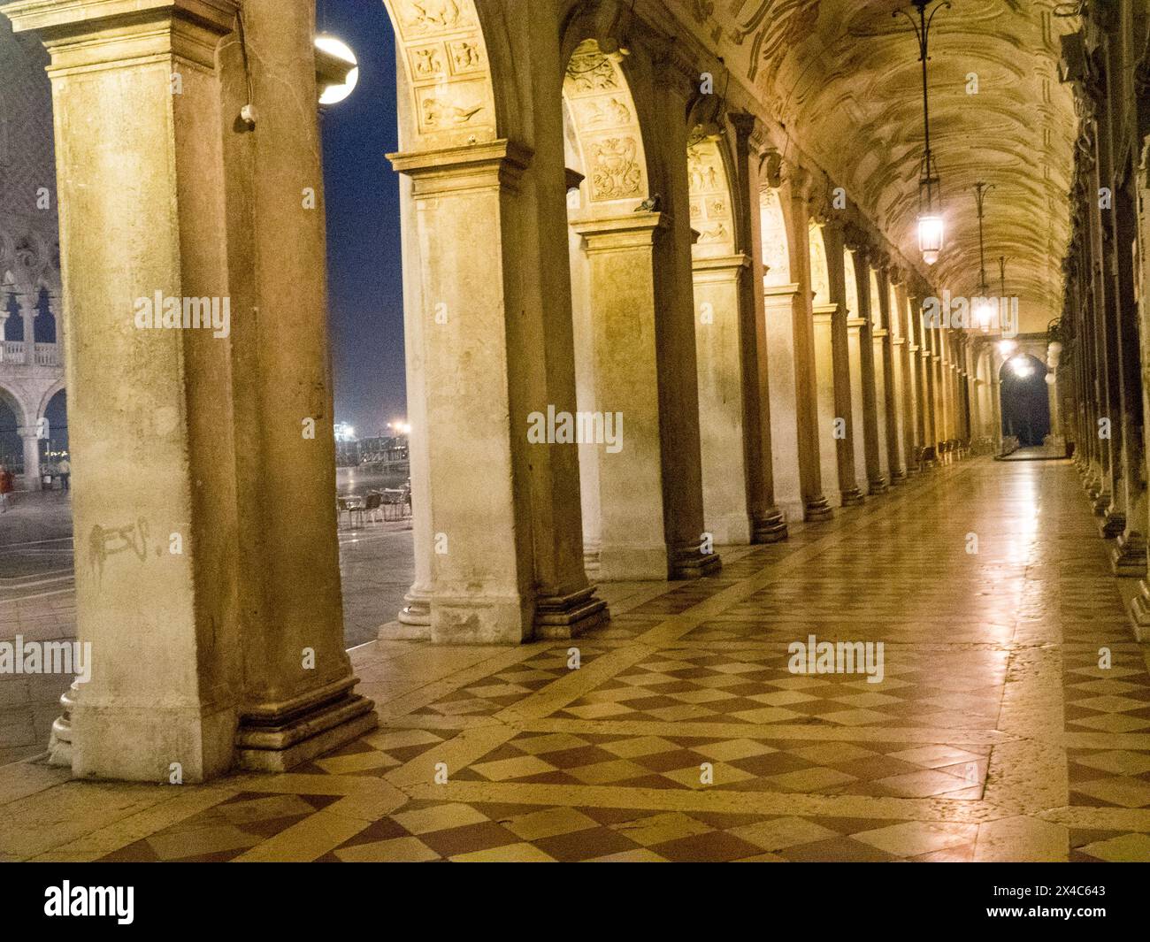 Italy, Venice. Corridor along the Doges Palace with ivory pillars and ...