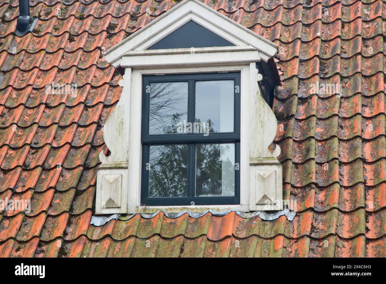 Reflection in a window of typical Dutch architecture in the fishing ...
